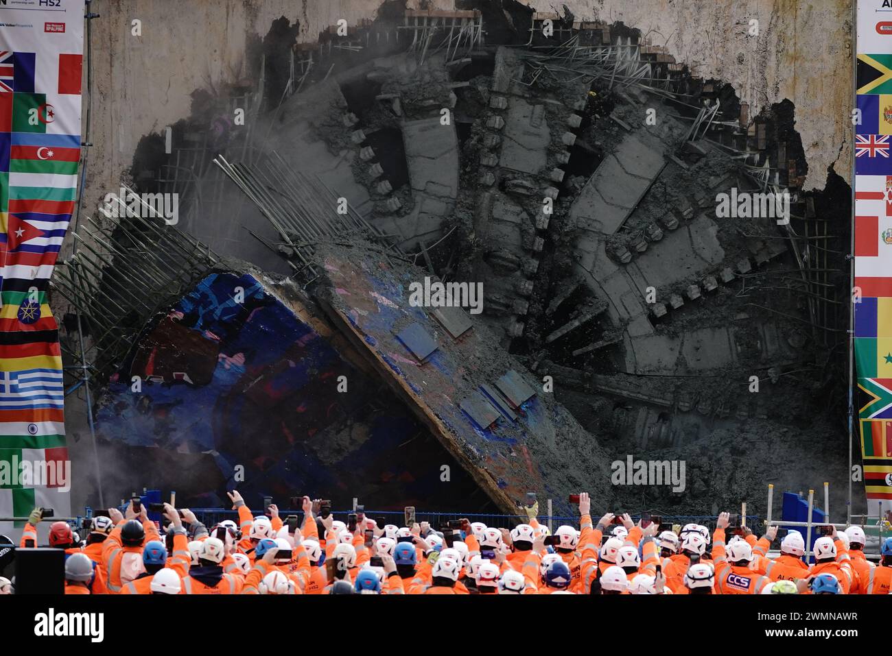 Workers hold up their mobile phones as digging machine Florence ...
