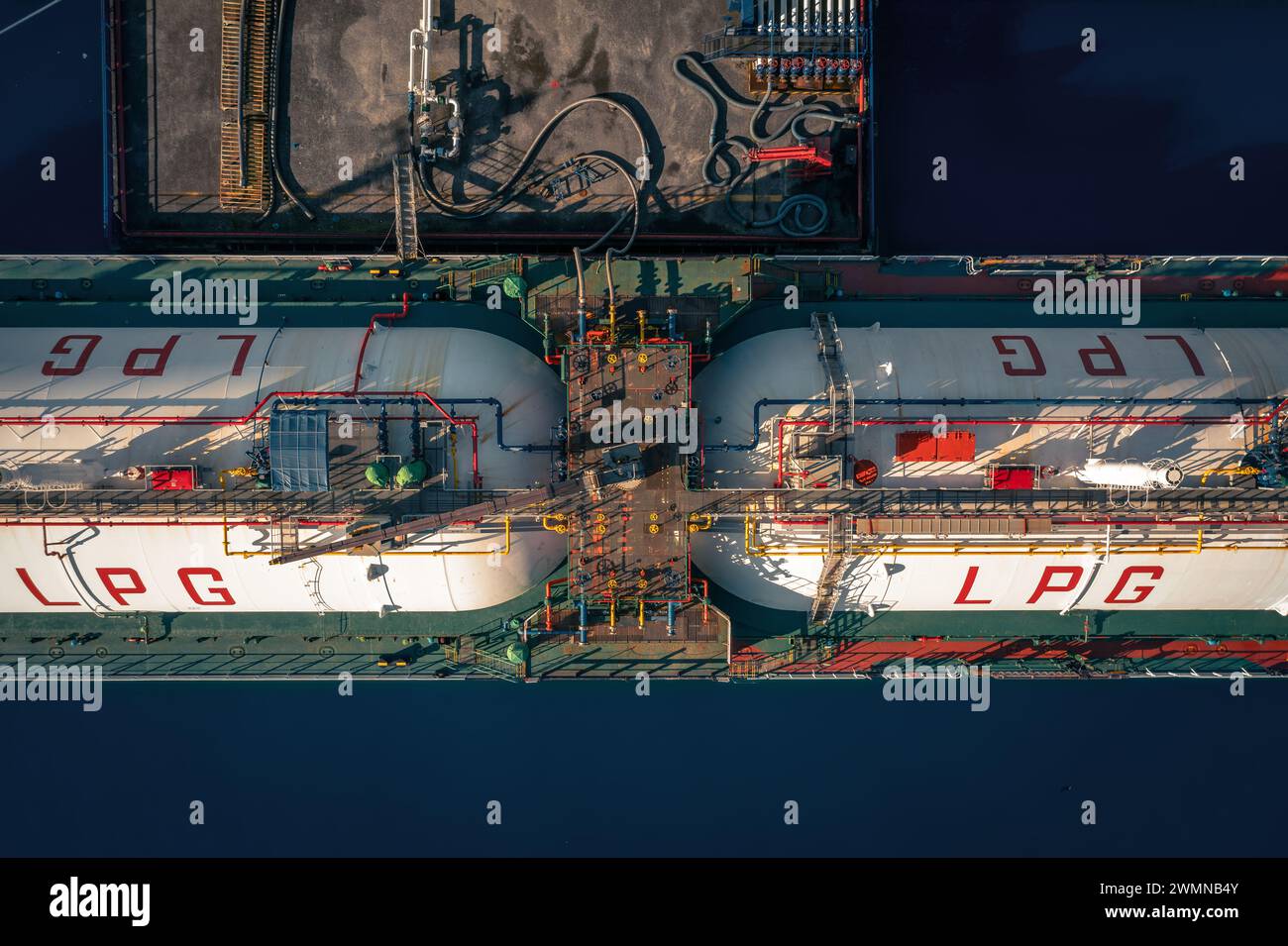 Aerial top down view of deck of LPG tanker ship with gas containers ...
