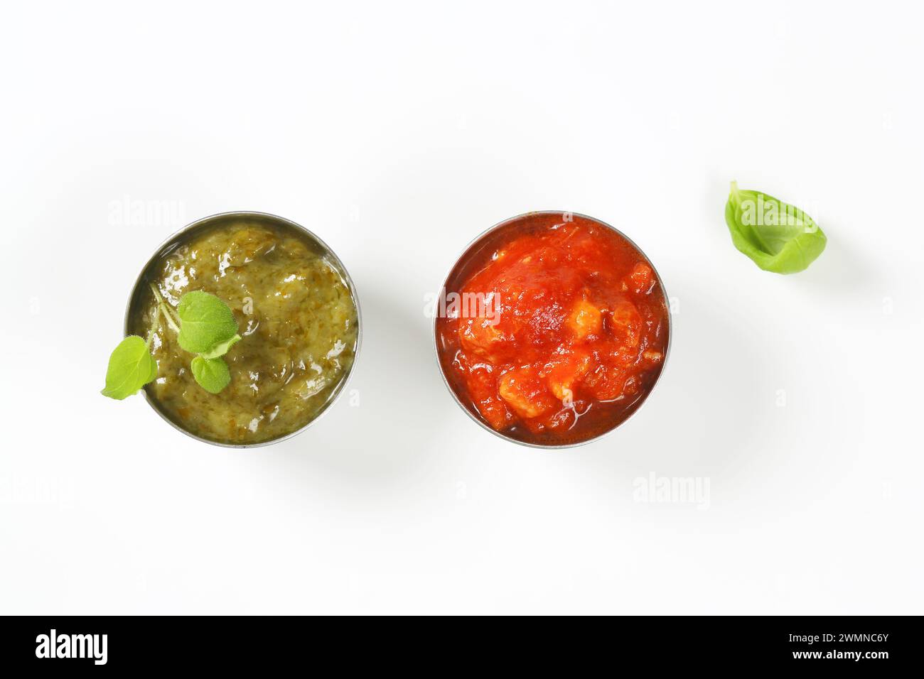 Basil pesto and tomato salsa in metal bowls Stock Photo - Alamy