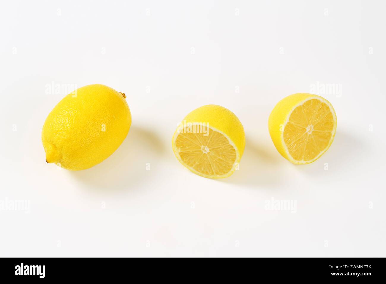 Two fresh lemon halves hi-res stock photography and images - Alamy