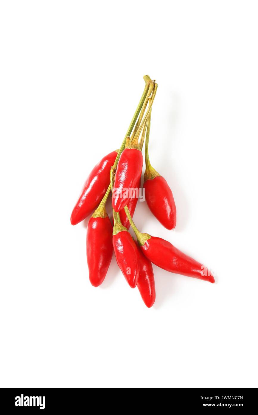 Small red chili peppers on white background Stock Photo - Alamy
