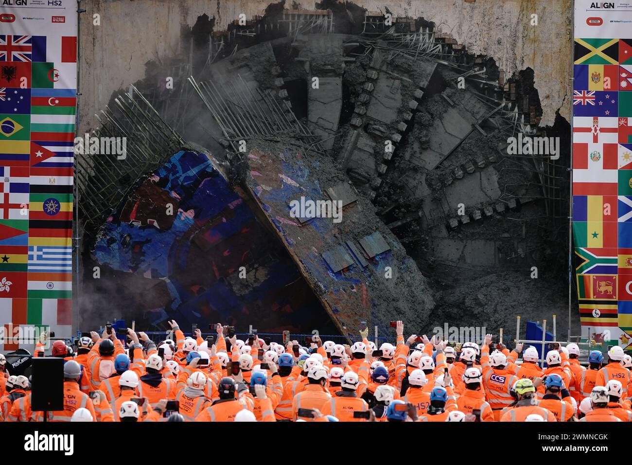 Workers hold up their mobile phones as digging machine Florence ...