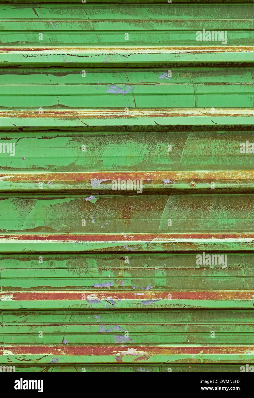 Green corrugated metal plate surrounding wasteland Stock Photo - Alamy