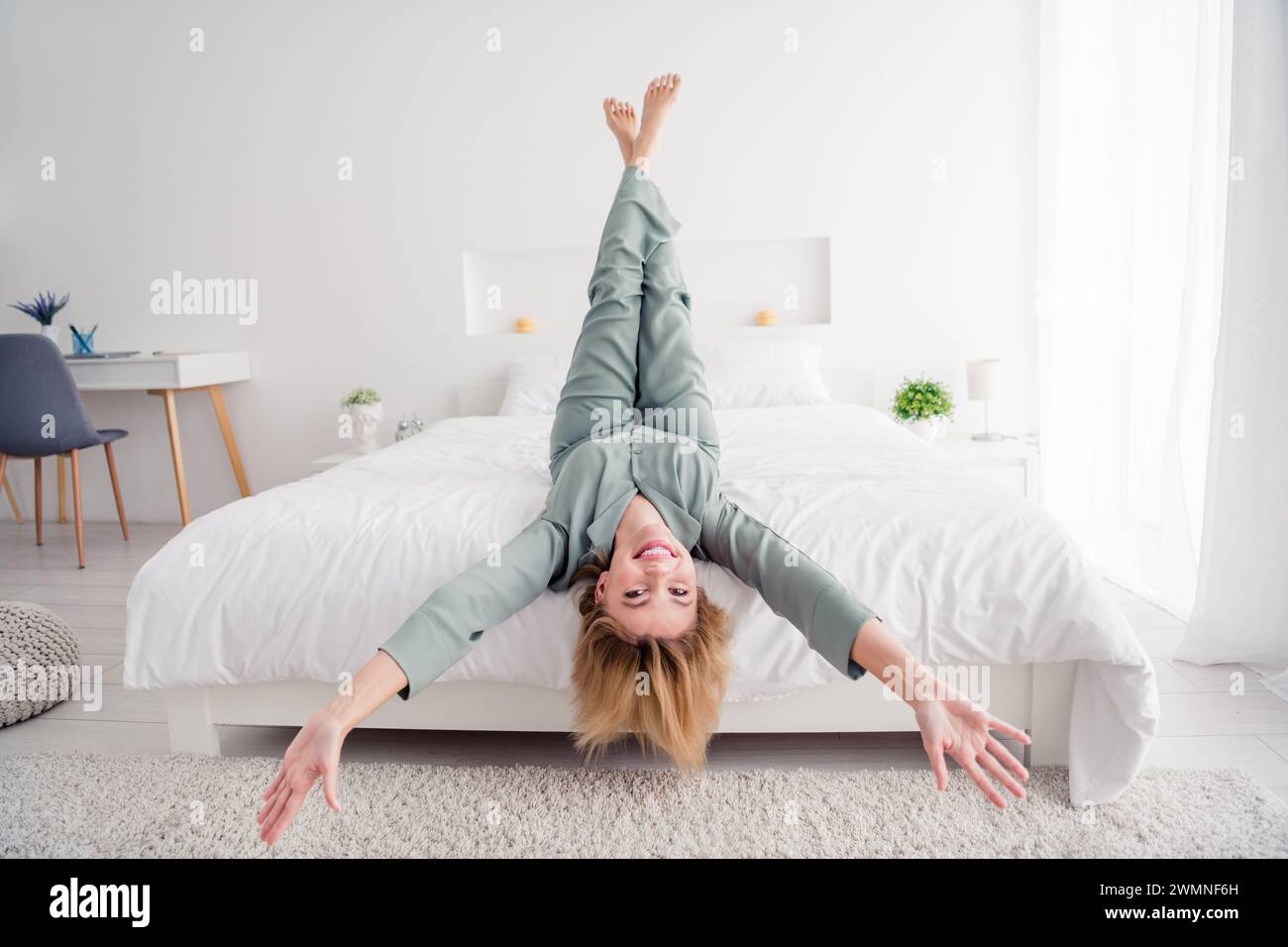 Full body size photo of young relaxed girl blonde hair model lying down ...