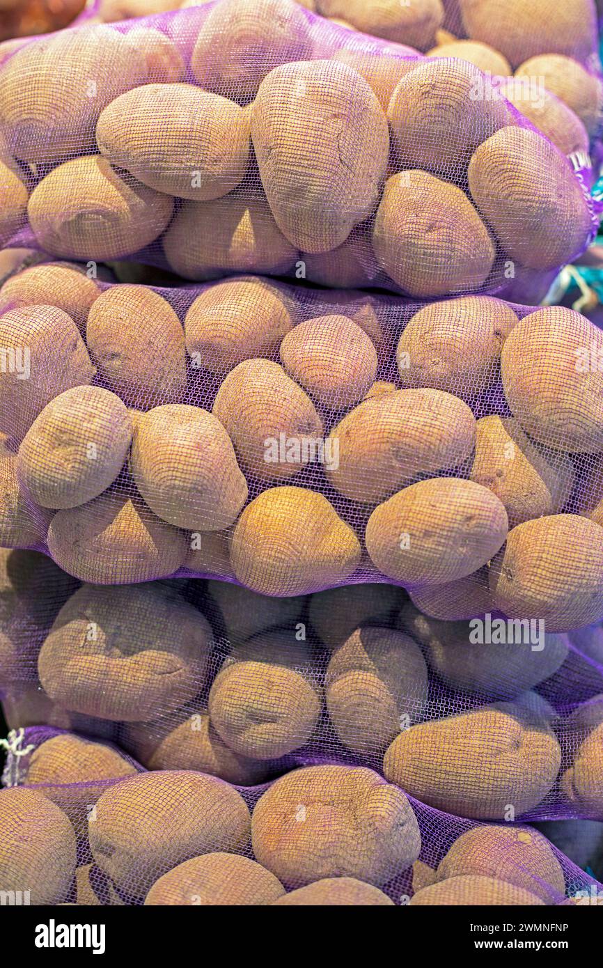 pre-packed varietal potatoes in nets in the supermarket Stock Photo - Alamy