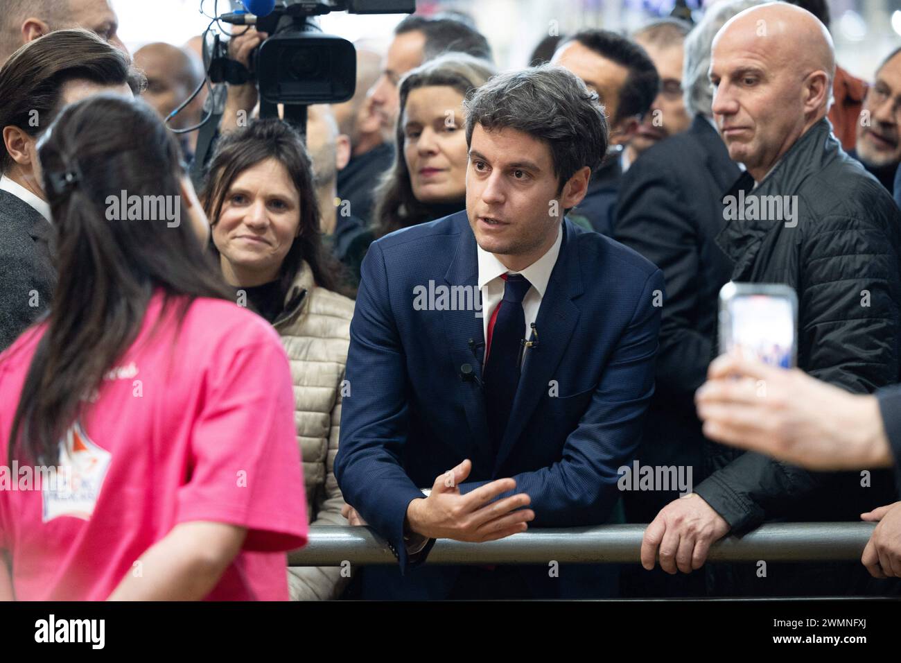 French Prime Minister Gabriel Attal pet a pig as he speaks to farmers ...