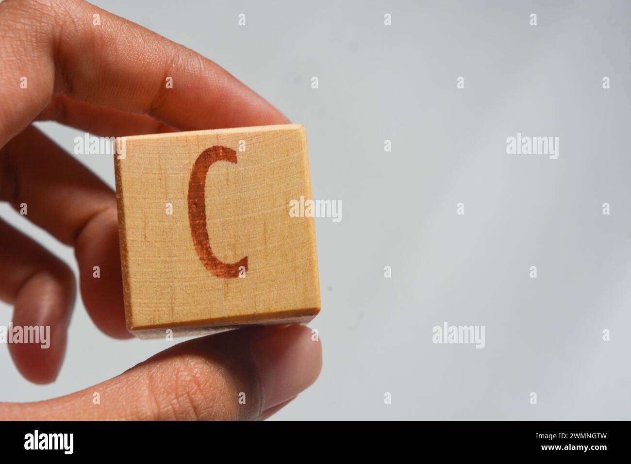 Letter C. Alphabet on wooden block. Isolated on a white background ...