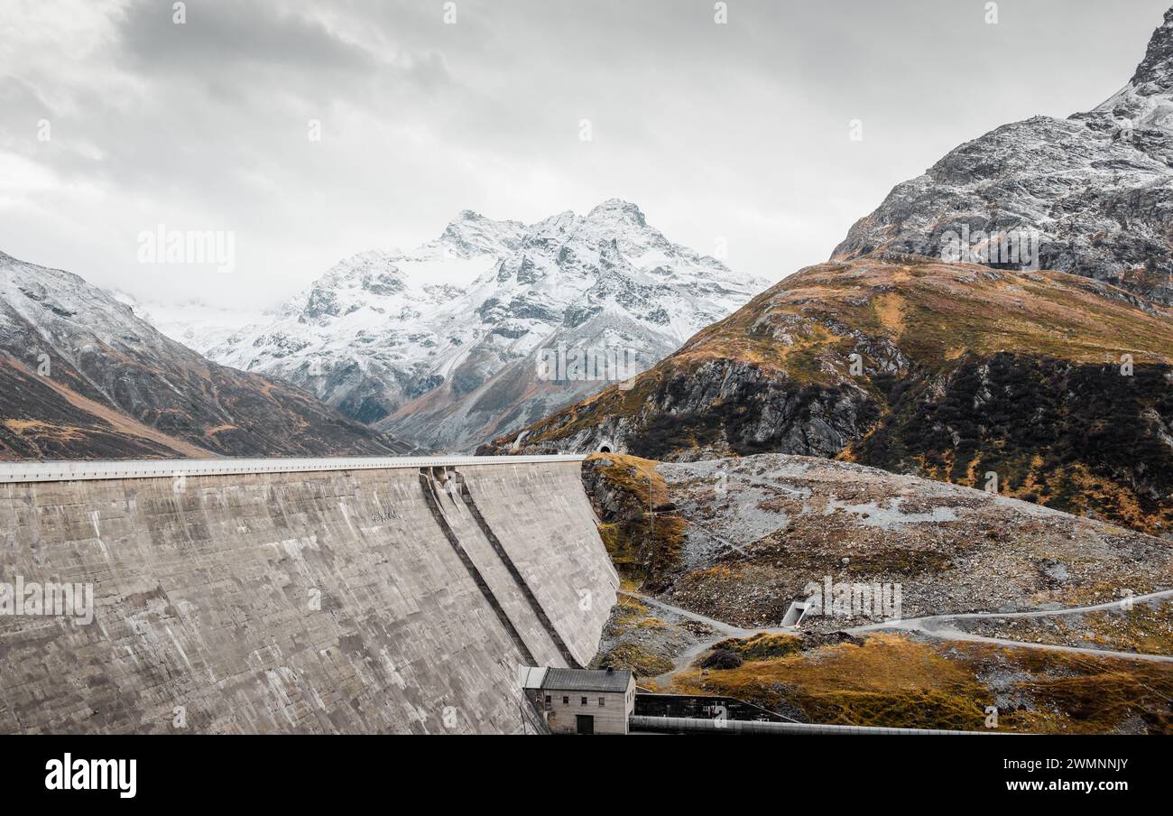Concrete dam in alpine valley in Silvretta Alps. Big grey man-made ...