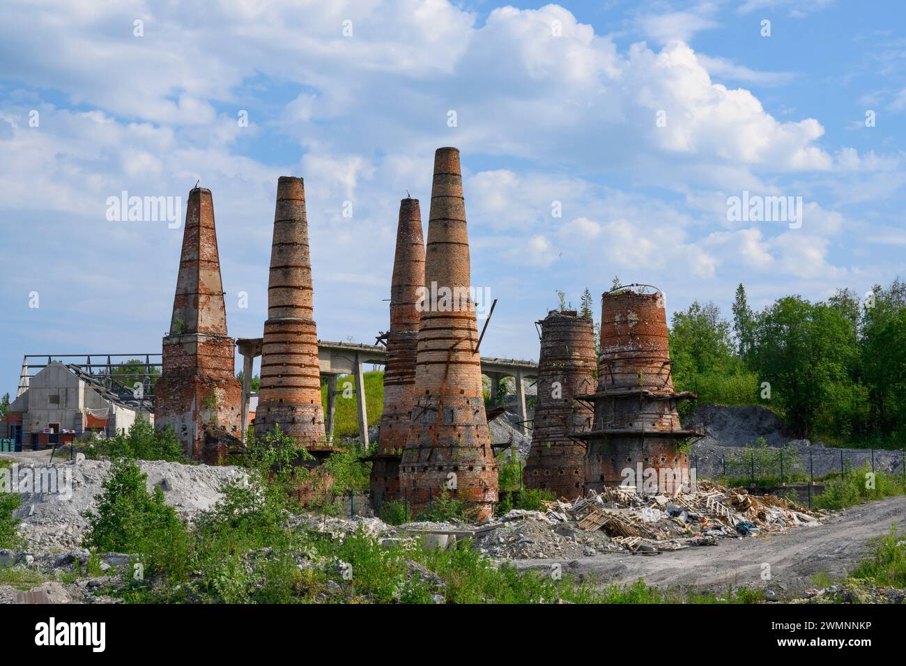 A landscape with huge cone-shaped brick chimneys of an abandoned ...