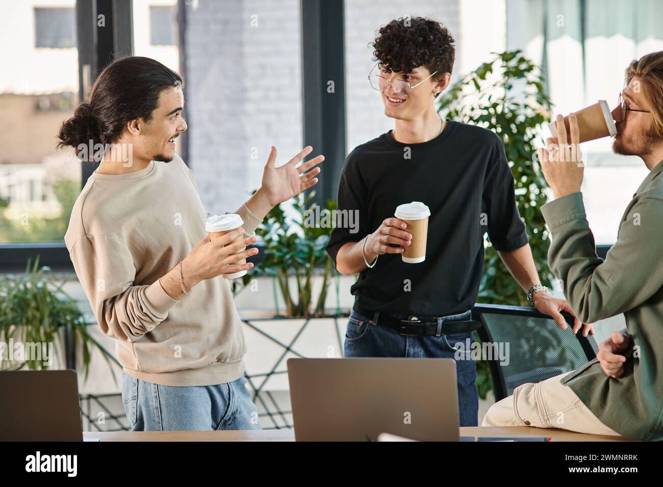 Conversation between three businessmen hi-res stock photography and ...