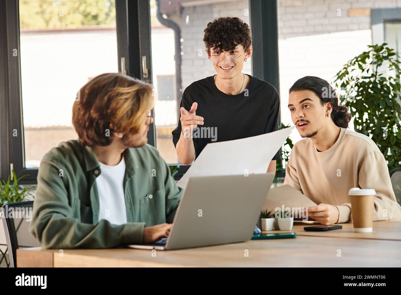 Team of young entrepreneurs in their 20s engaged in project planning in ...