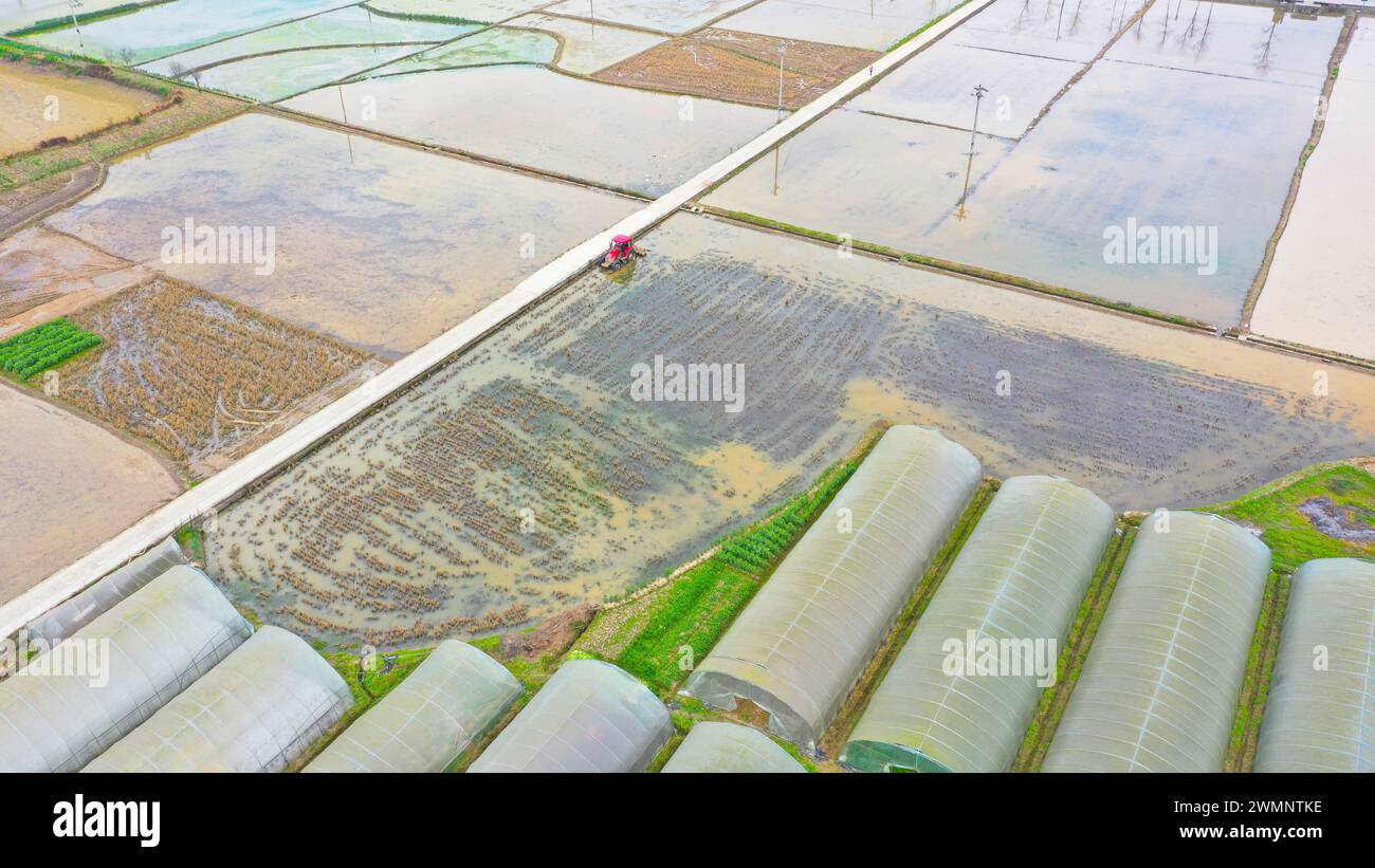 CHONGQING, CHINA - FEBRUARY 27, 2024 - Villagers drive a cultivator to ...