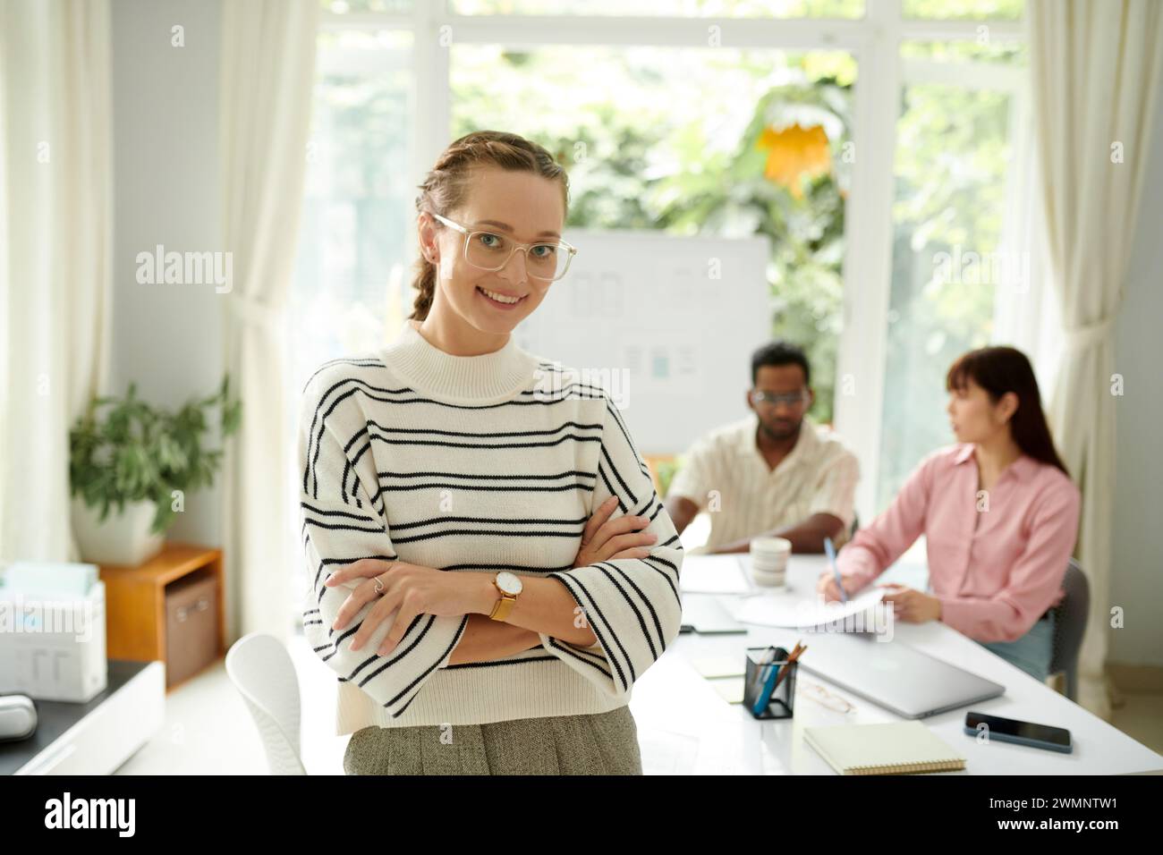 Young office manager in hi-res stock photography and images - Alamy