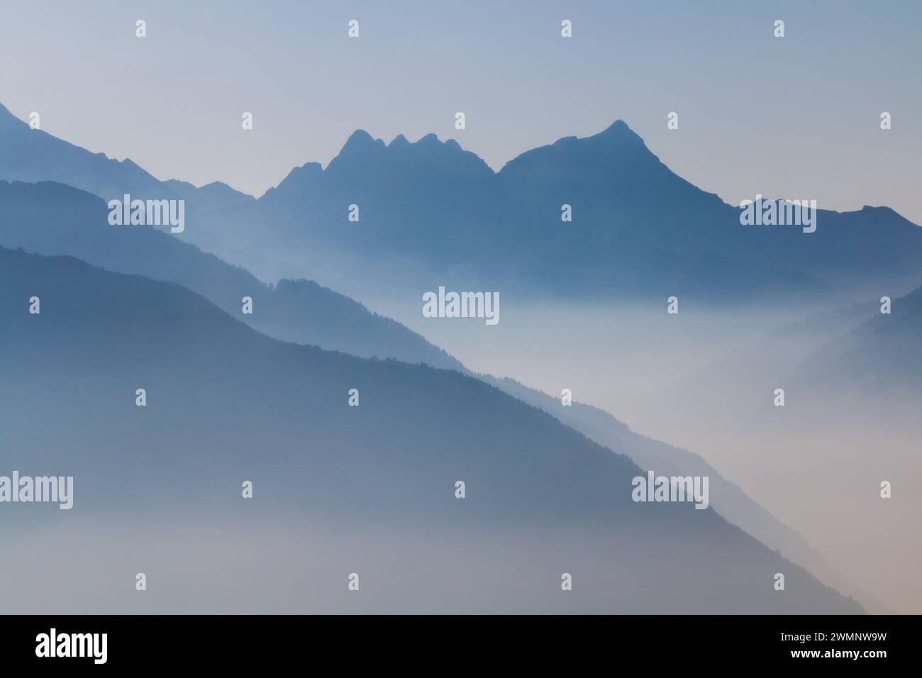 Spectacular mountain ranges silhouettes in shade of grey Stock Photo ...