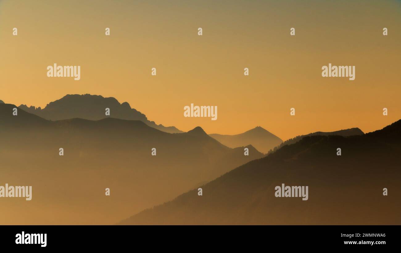 Spectacular mountain ranges silhouettes in shades of yellow Stock Photo ...