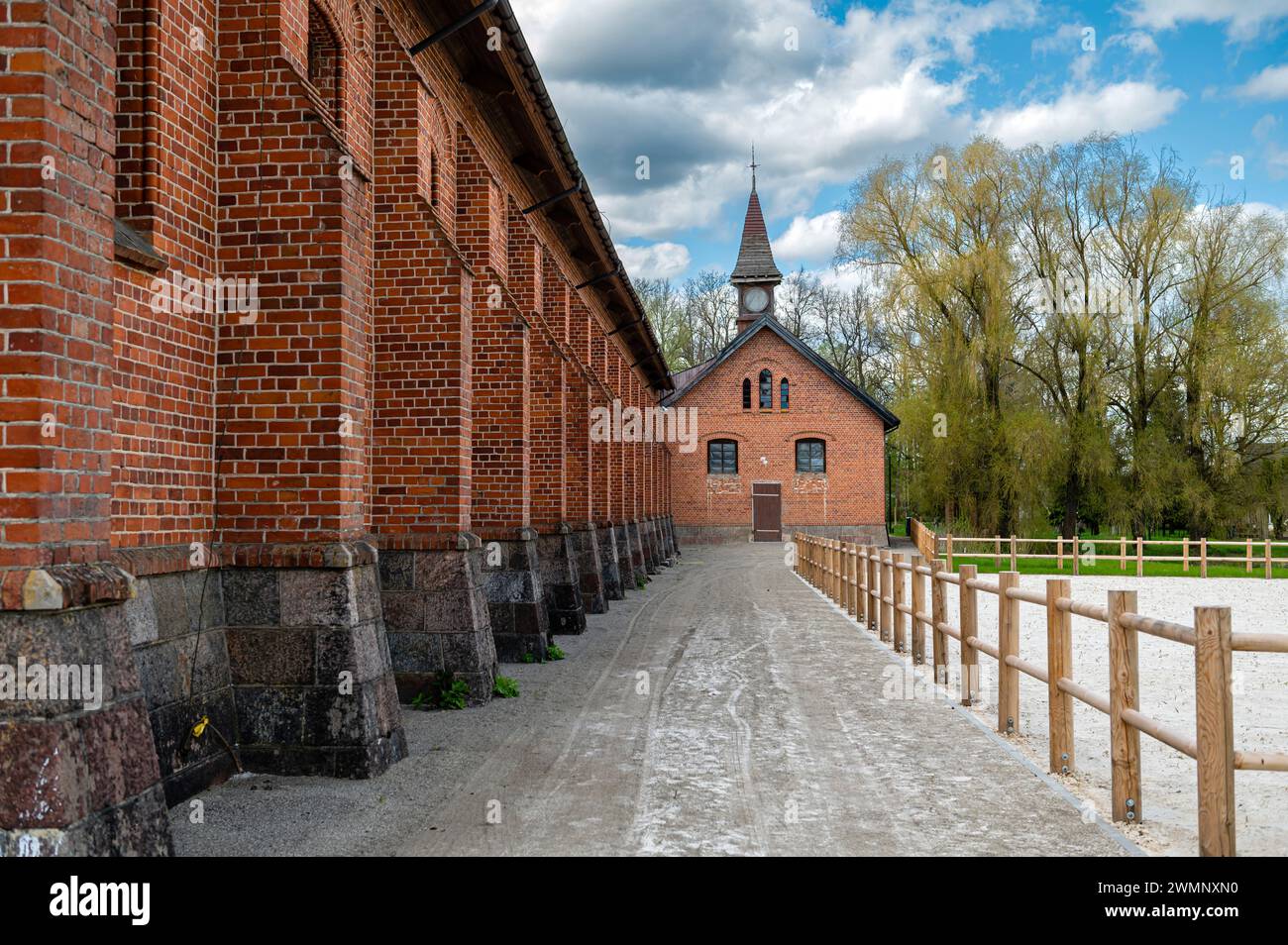 Zagare manor red brick stud farm complex on a sunny spring day ...