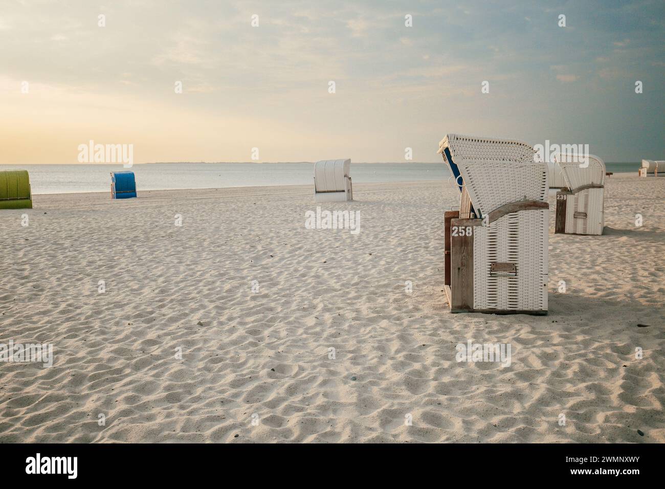 Beach cabins on white sand. Vacation on the North Sea. Beaches of the ...