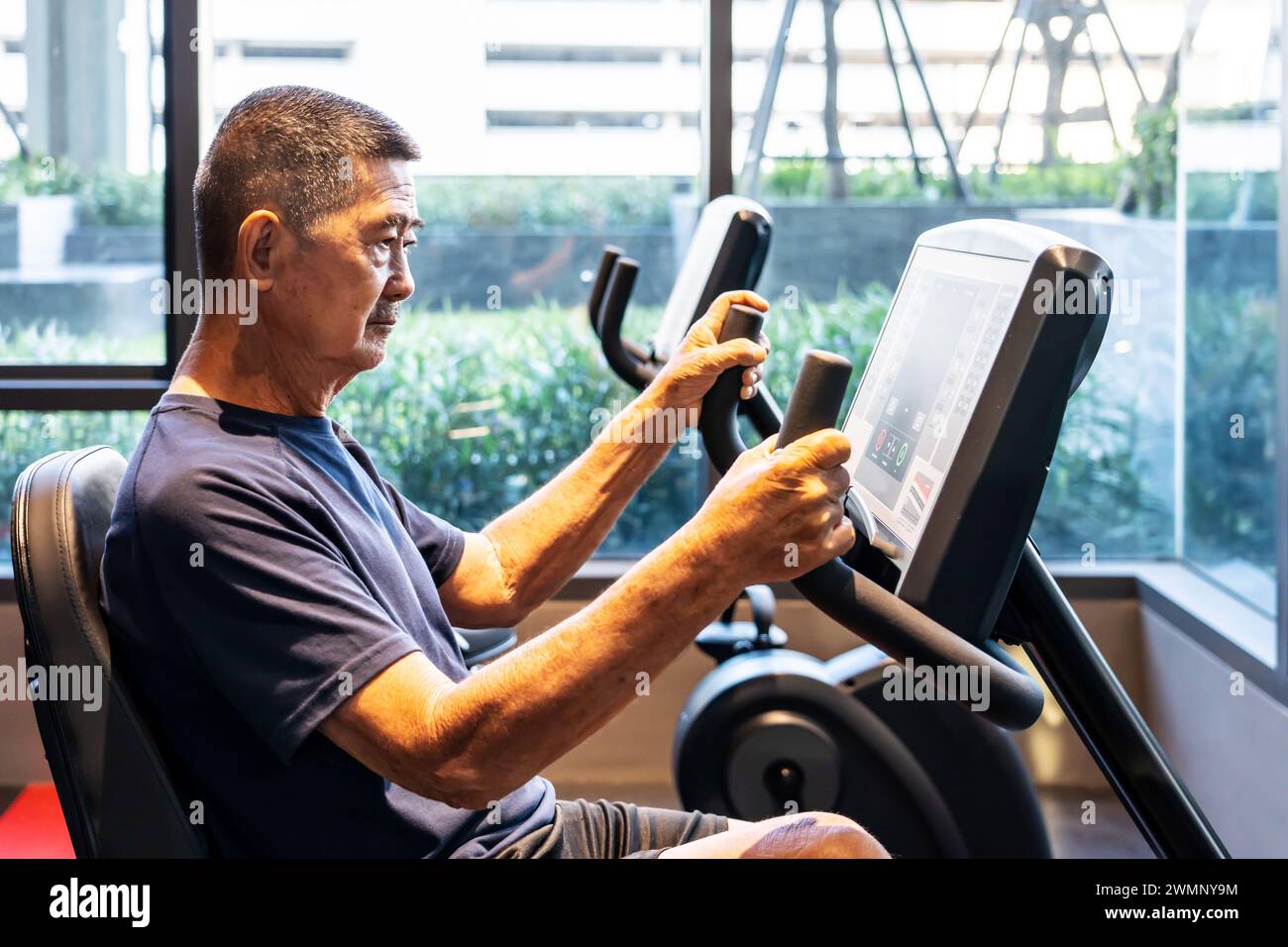 Old person walking on treadmill hi-res stock photography and images - Alamy