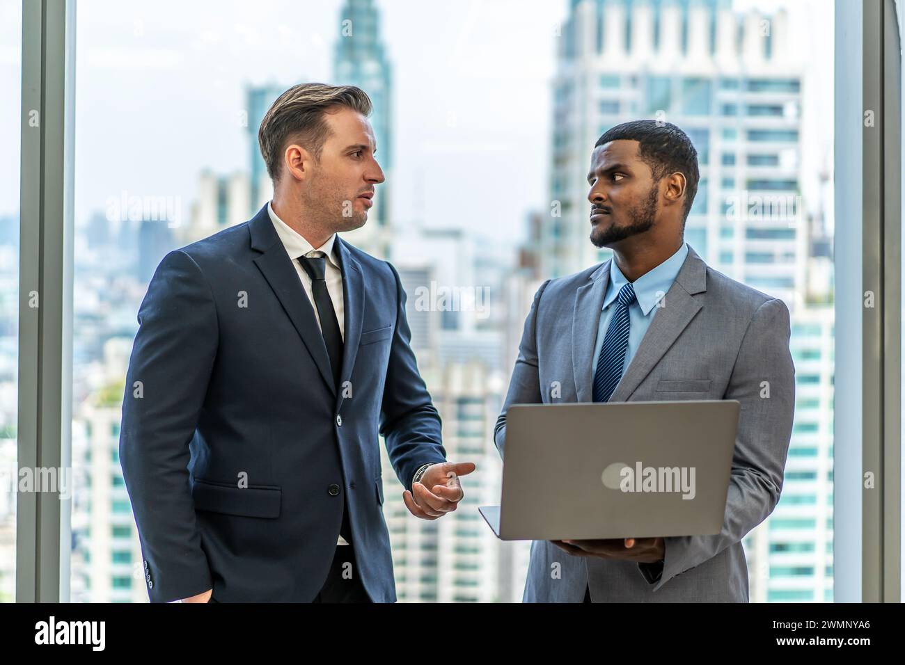Two professionals standing together in hi-res stock photography and ...