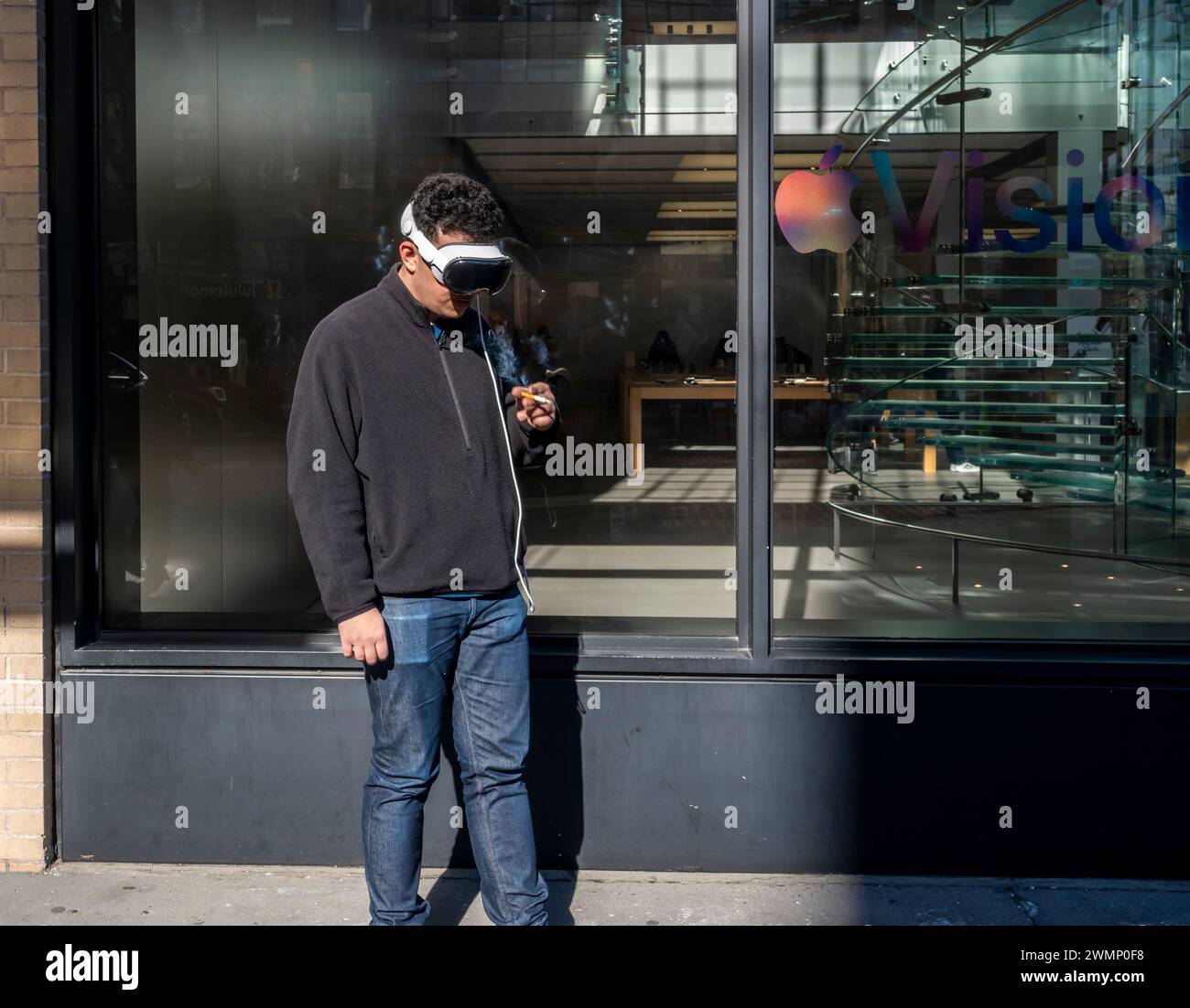 Outside the Apple store in the Meatpacking District of New York a man ...
