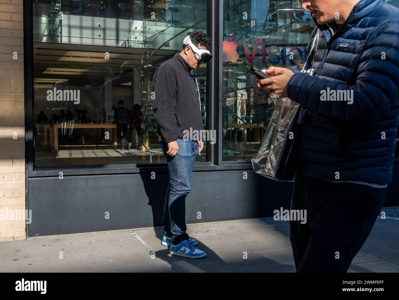 Outside the Apple store in the Meatpacking District of New York a man ...