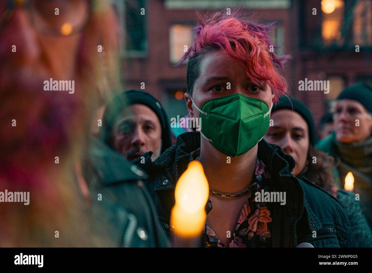 People hold a vigil outside The Stonewall Inn to mourn the death of ...