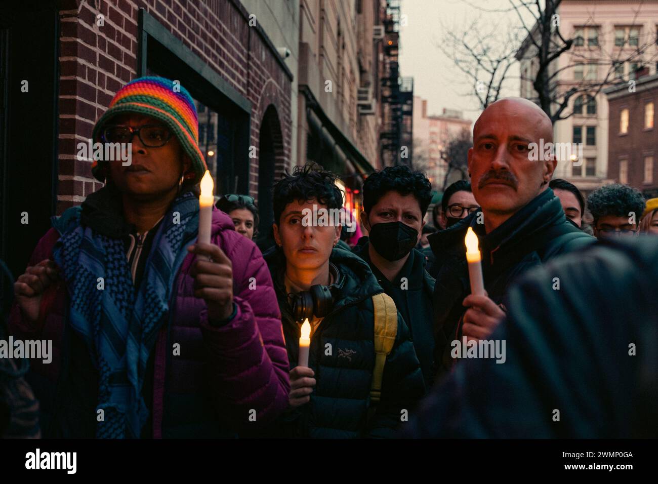 People hold a vigil outside The Stonewall Inn to mourn the death of ...