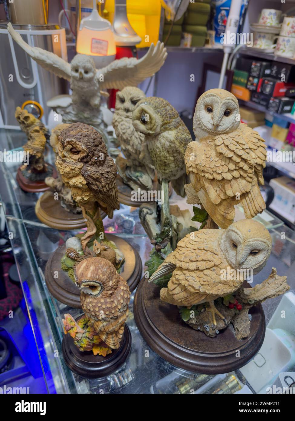 Owl sculptures displayed in a shop for selling Stock Photo - Alamy