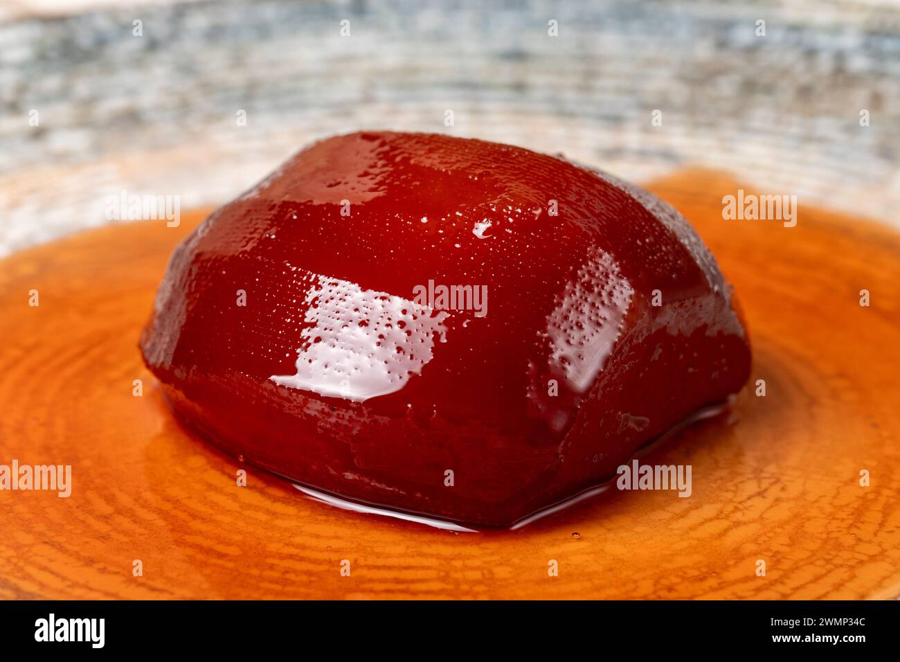 Quince dessert with syrup. Milk dessert. Quince dessert on a plate ...