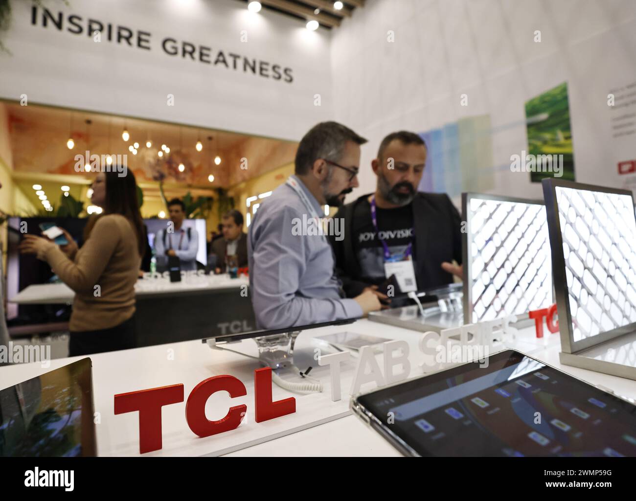 Barcelona, Spain. 26th Feb, 2024. People visit the TCL booth during the Mobile World Congress ...