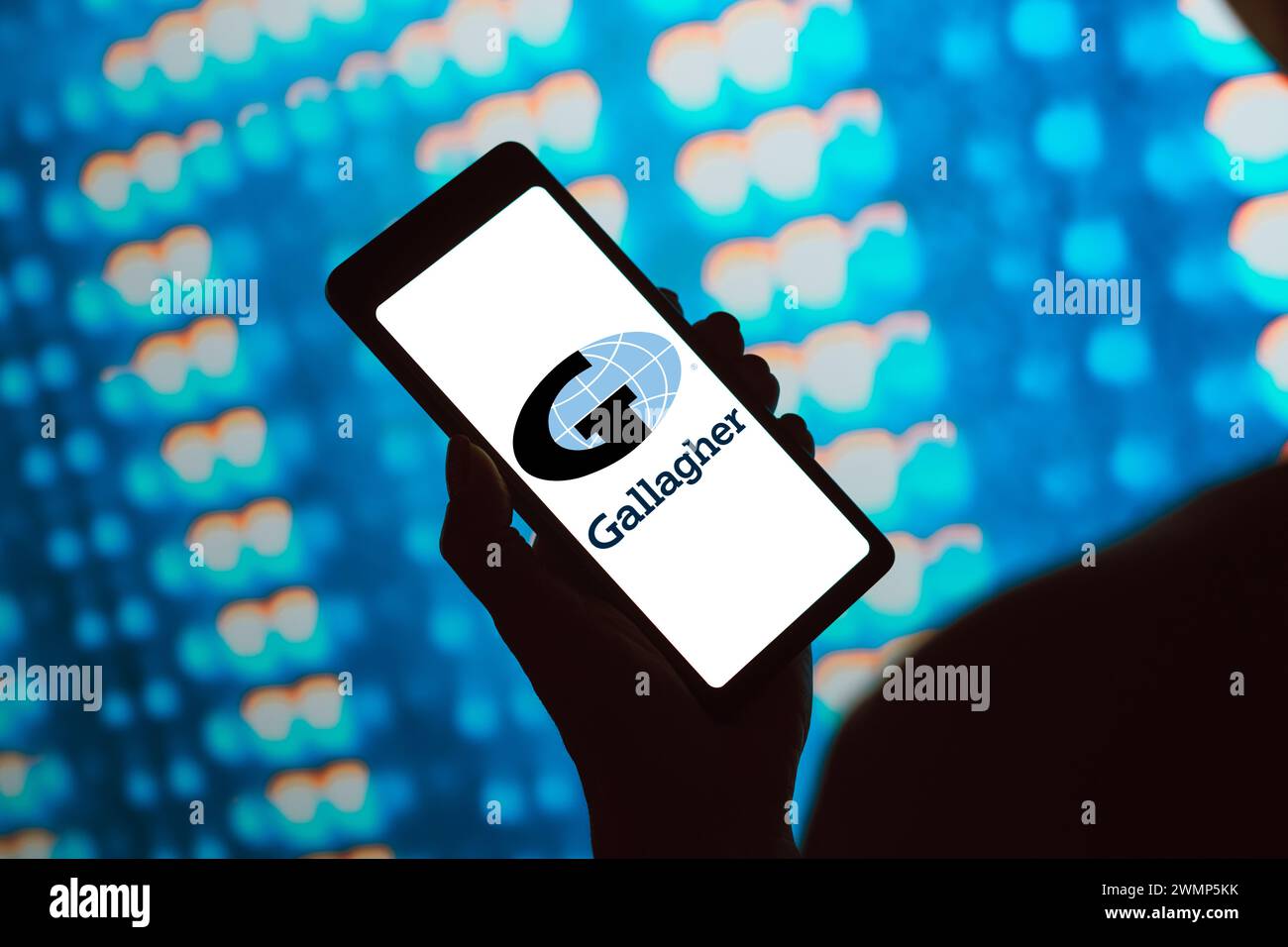 In this photo illustration, the Arthur J. Gallagher (AJG) logo is ...