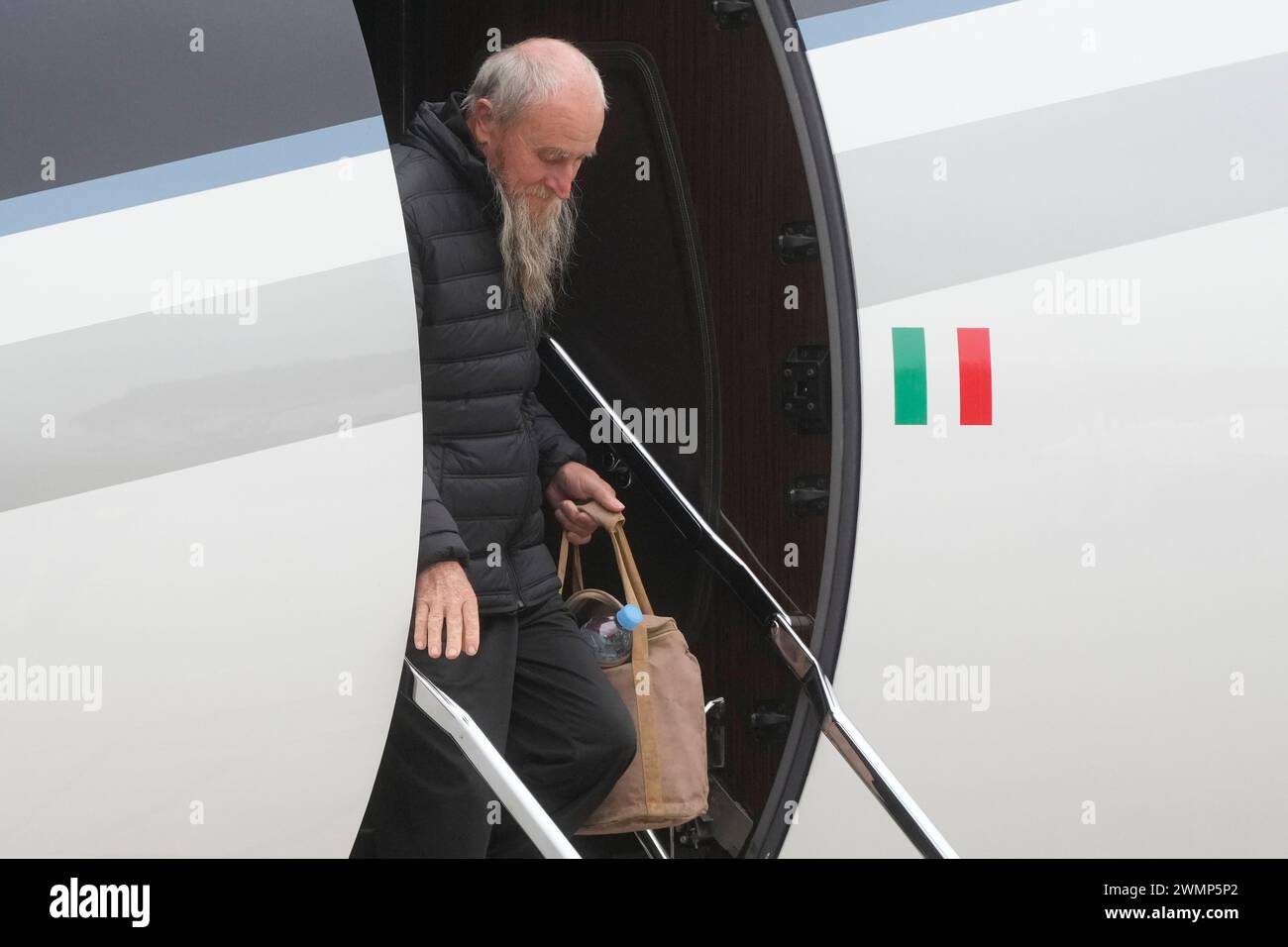 Rocco Antonio Langone gets off a plane after arriving with his wife ...