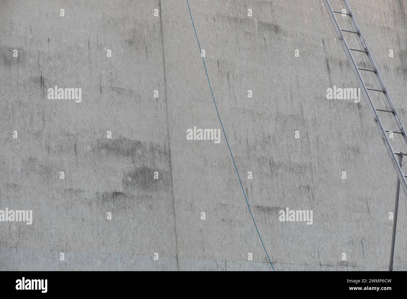 High ladder against the wall of a block of flats Stock Photo - Alamy
