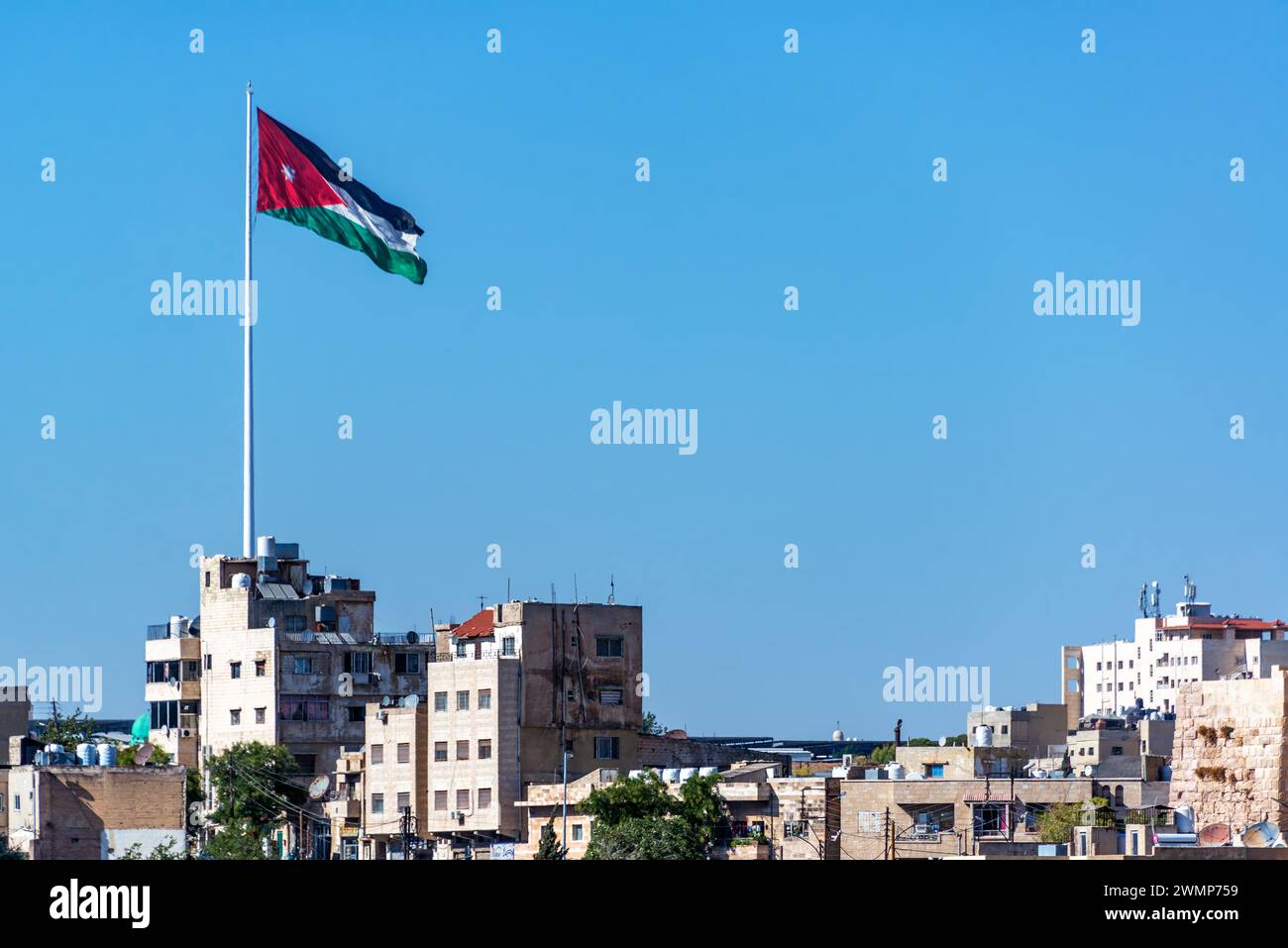 Large Jordanian flag flying over the city of Amman, Jordan Stock Photo ...