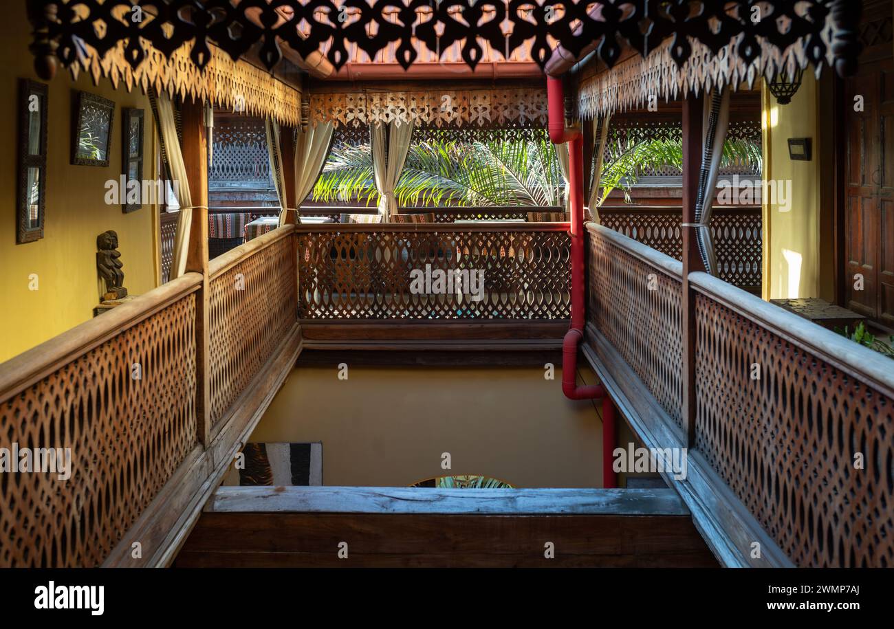 Ornate carved wooden screens on a landing in Jafferji House, a former ...