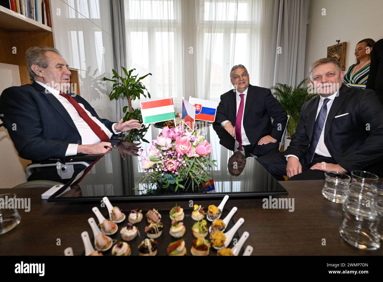 Former President Milos Zeman (left) meets with Slovak Prime Minister Robert Fico (right) and ...