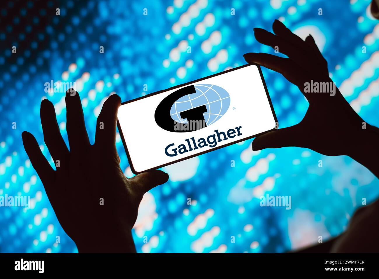 In this photo illustration, the Arthur J. Gallagher (AJG) logo is ...