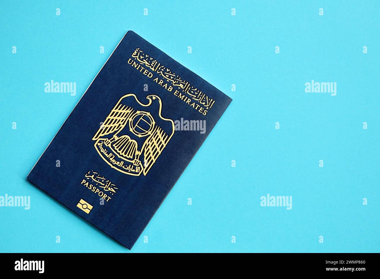 Blue United Arab Emirates passport on blue background close up. Tourism ...