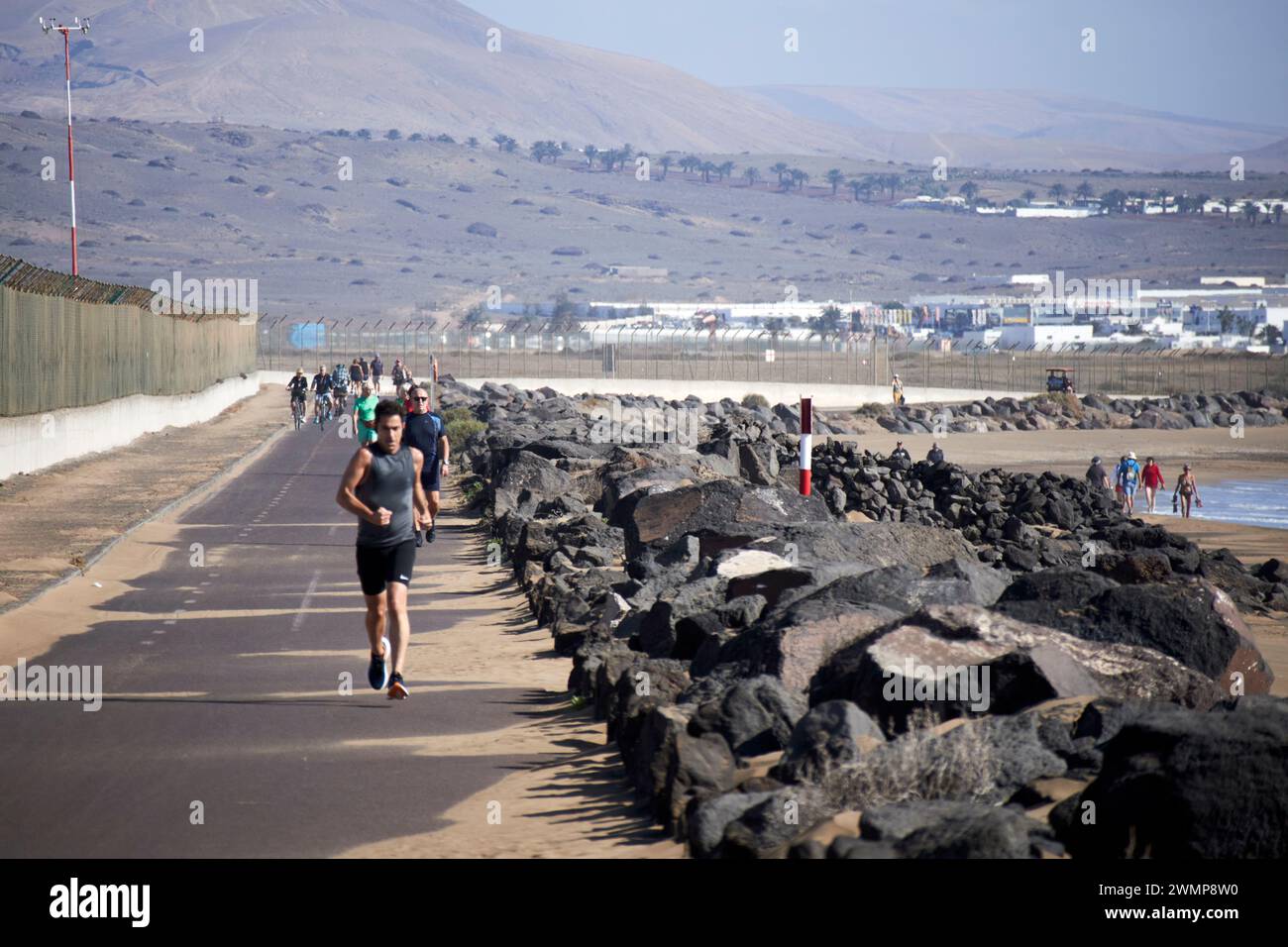 people out running, jogging walking and cycling along the airport ...