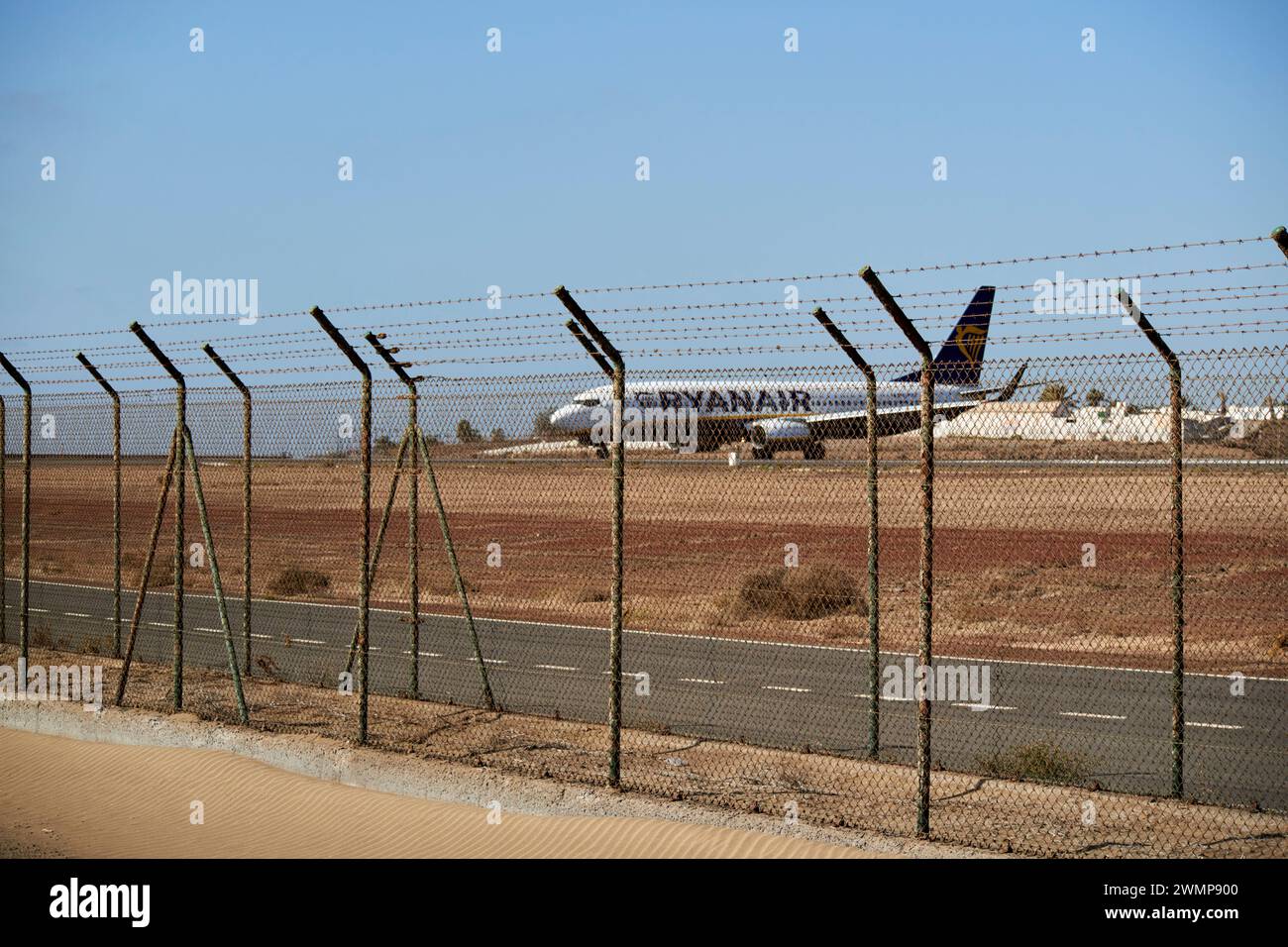 perimeter fence at ace arrecife airport with ryanair boeing 737 ...
