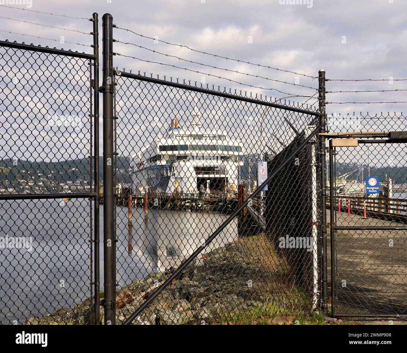An out of service British Columbia Ferry docked behind a locked gate at ...