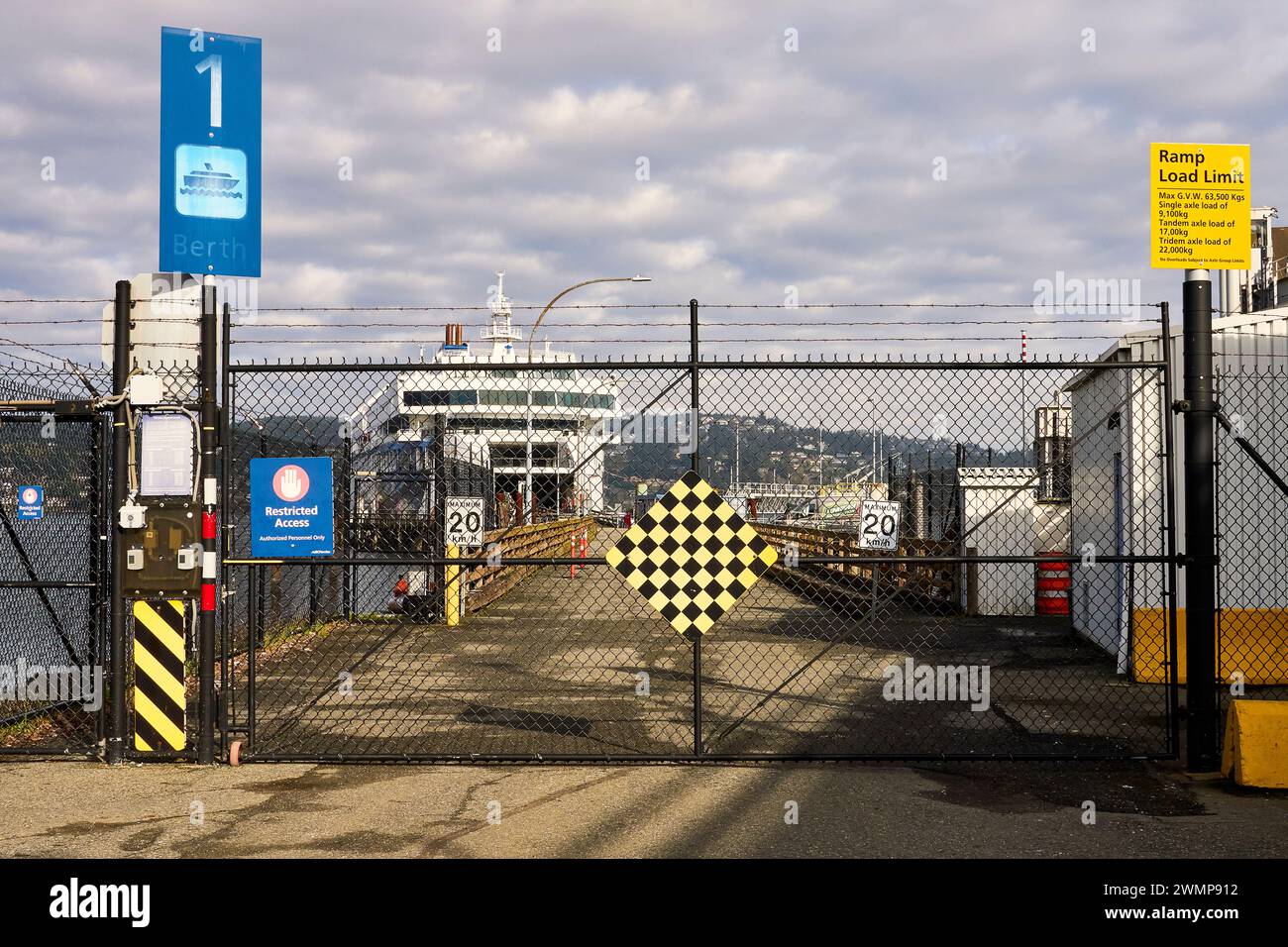 Out of service ferry docked behind closed gates at the Departure Bay ...