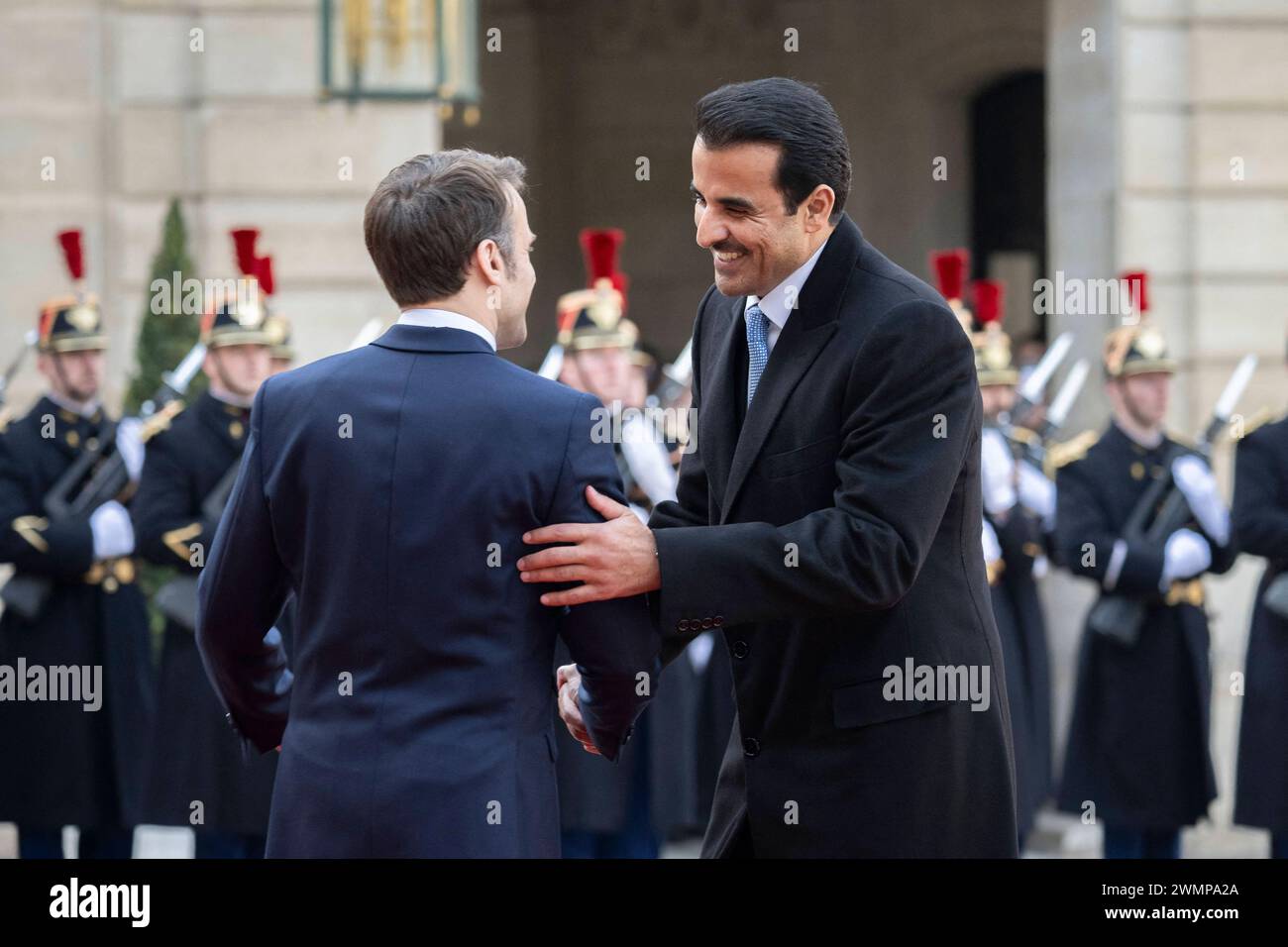 Paris, France. 27th Feb, 2024. French president Emmanuel Macron welcomes Qatar's Emir Sheikh ...
