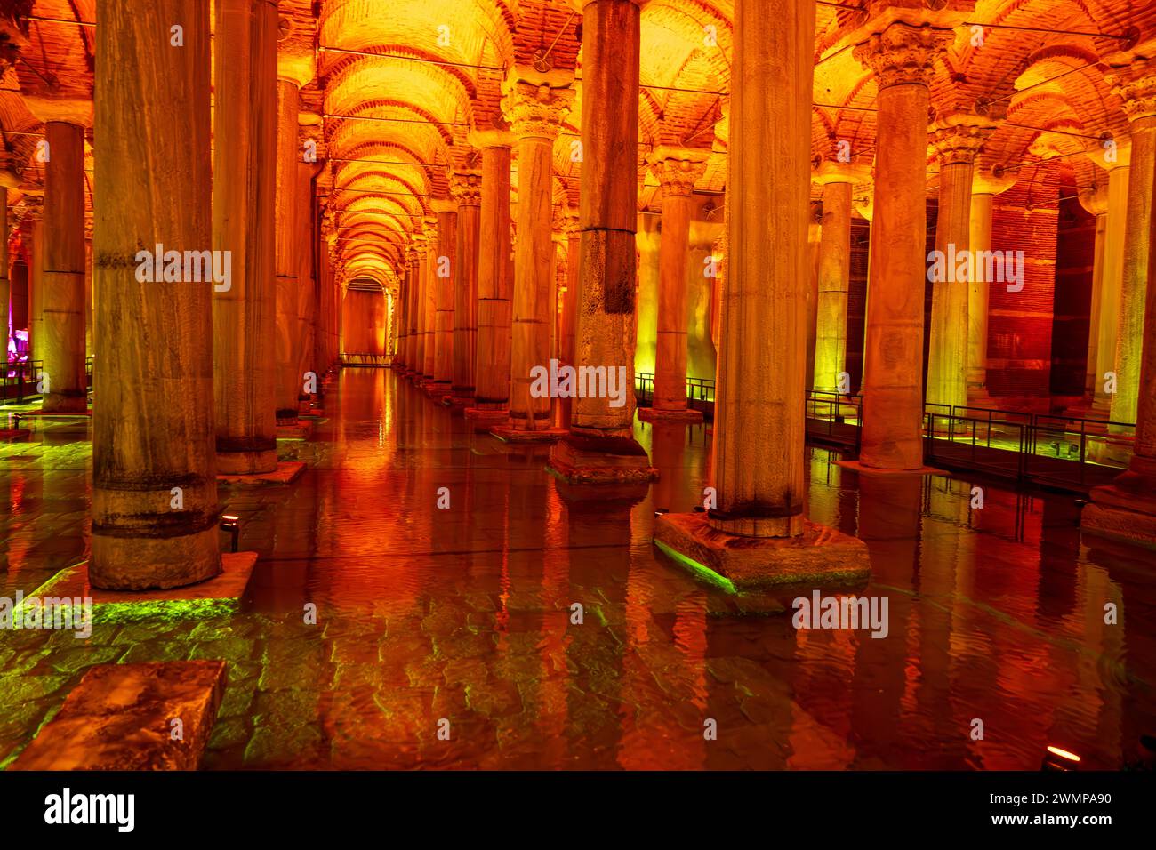 An interior space with bright ceiling lights and marble columns ...