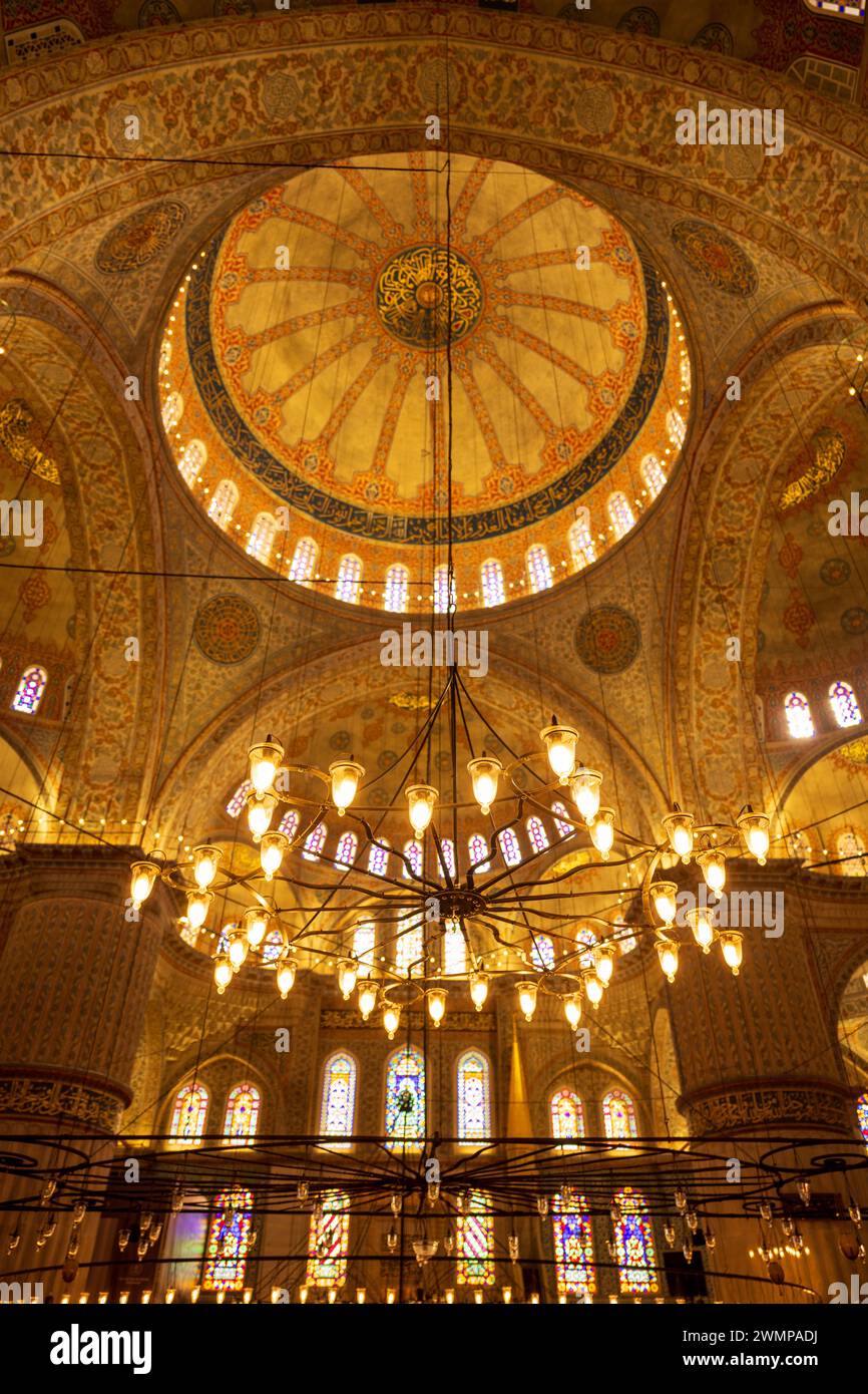 The interior of a building with a spacious ceiling filled with multiple ...