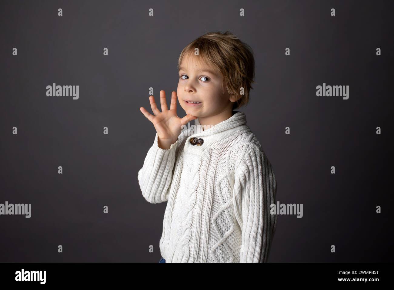 Cute little toddler boy, showing MOTHER gesture in sign language on ...