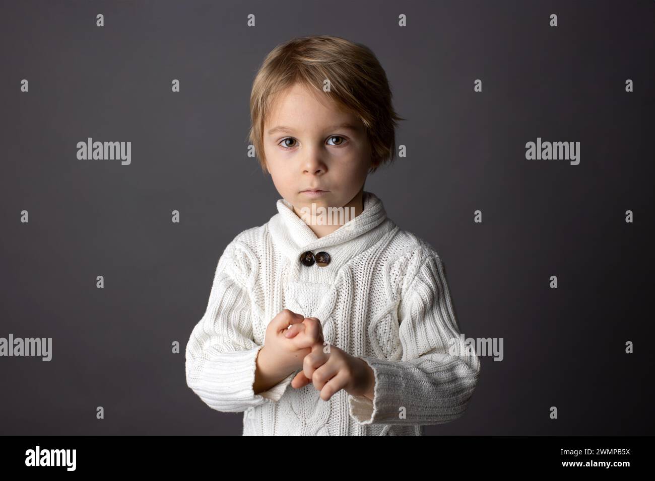 Cute little toddler boy, showing FRIEND gesture in sign language on ...