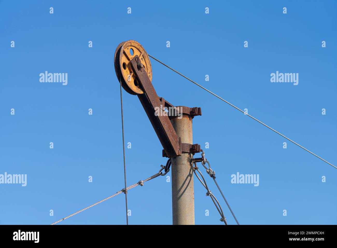 the pulleys on a pylon for lifting fishing nets Stock Photo - Alamy