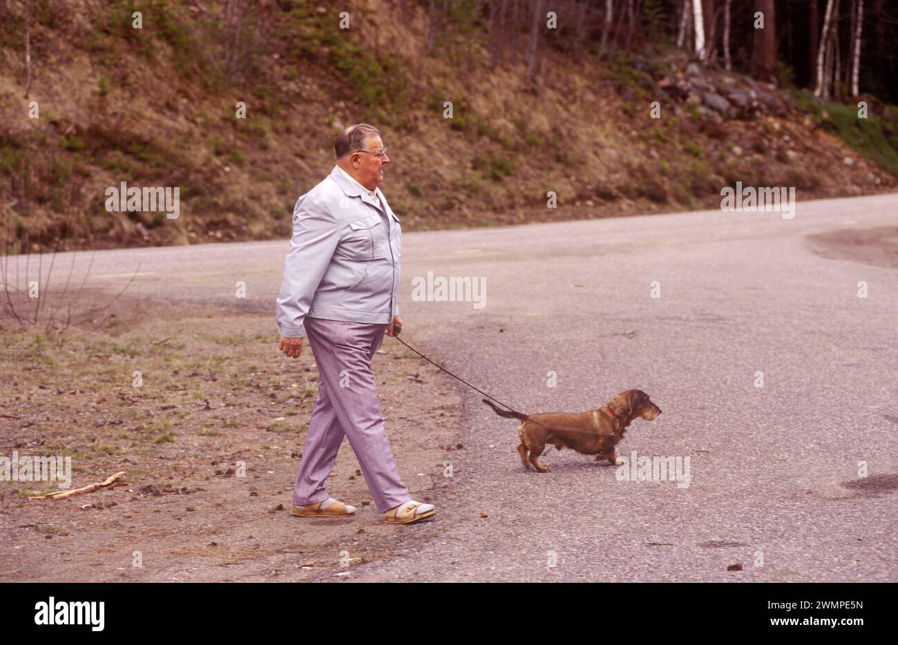 Old man walking with dog hi-res stock photography and images - Alamy