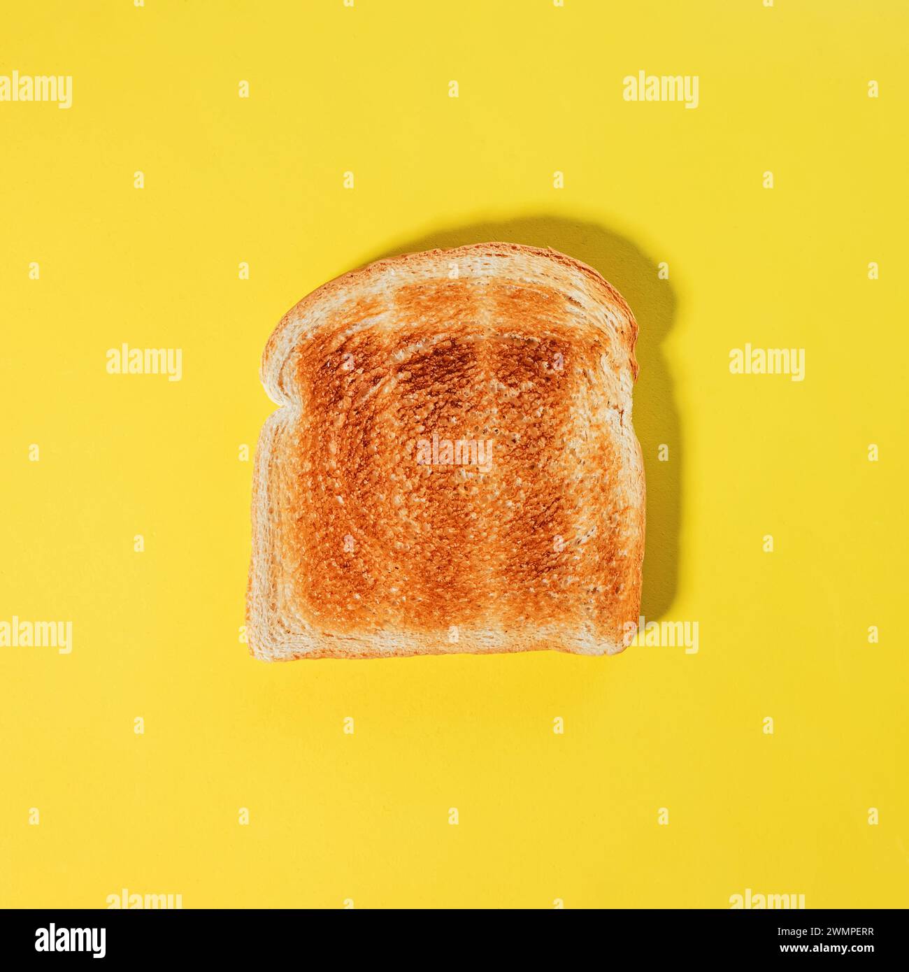 Square bread slice, toast isolated on the yellow background Stock Photo ...